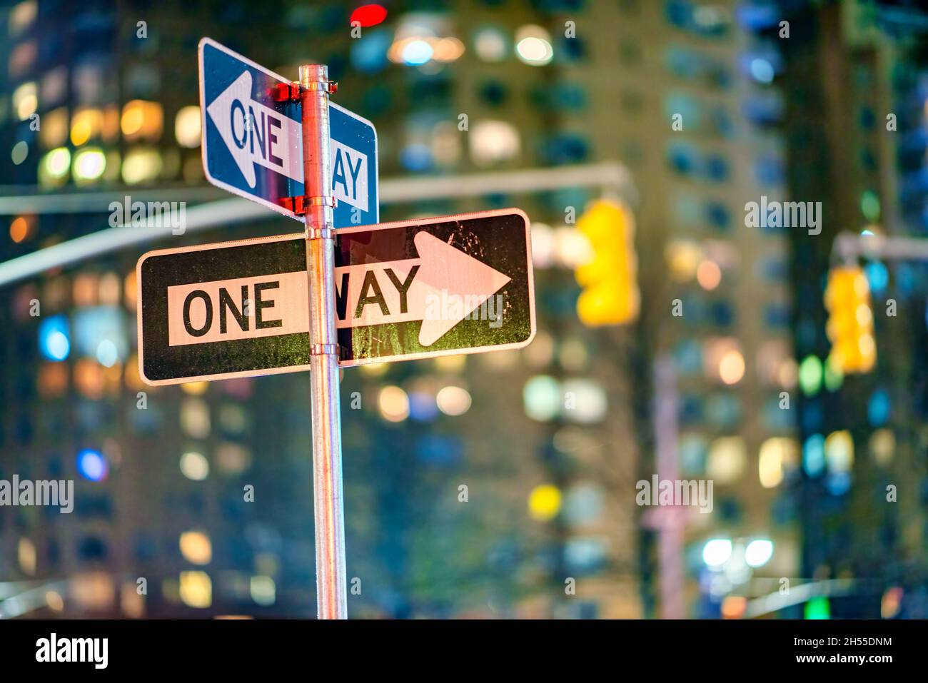 One way signs at night in New York City - Manhattan Stock Photo - Alamy