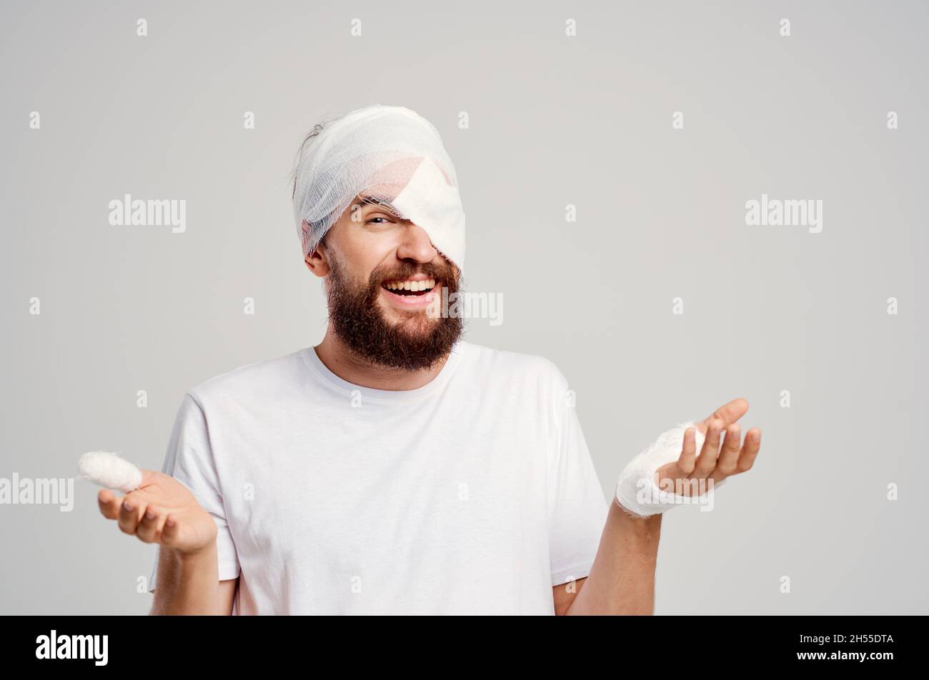 male patient with bandaged head and eye hospitalization light ...