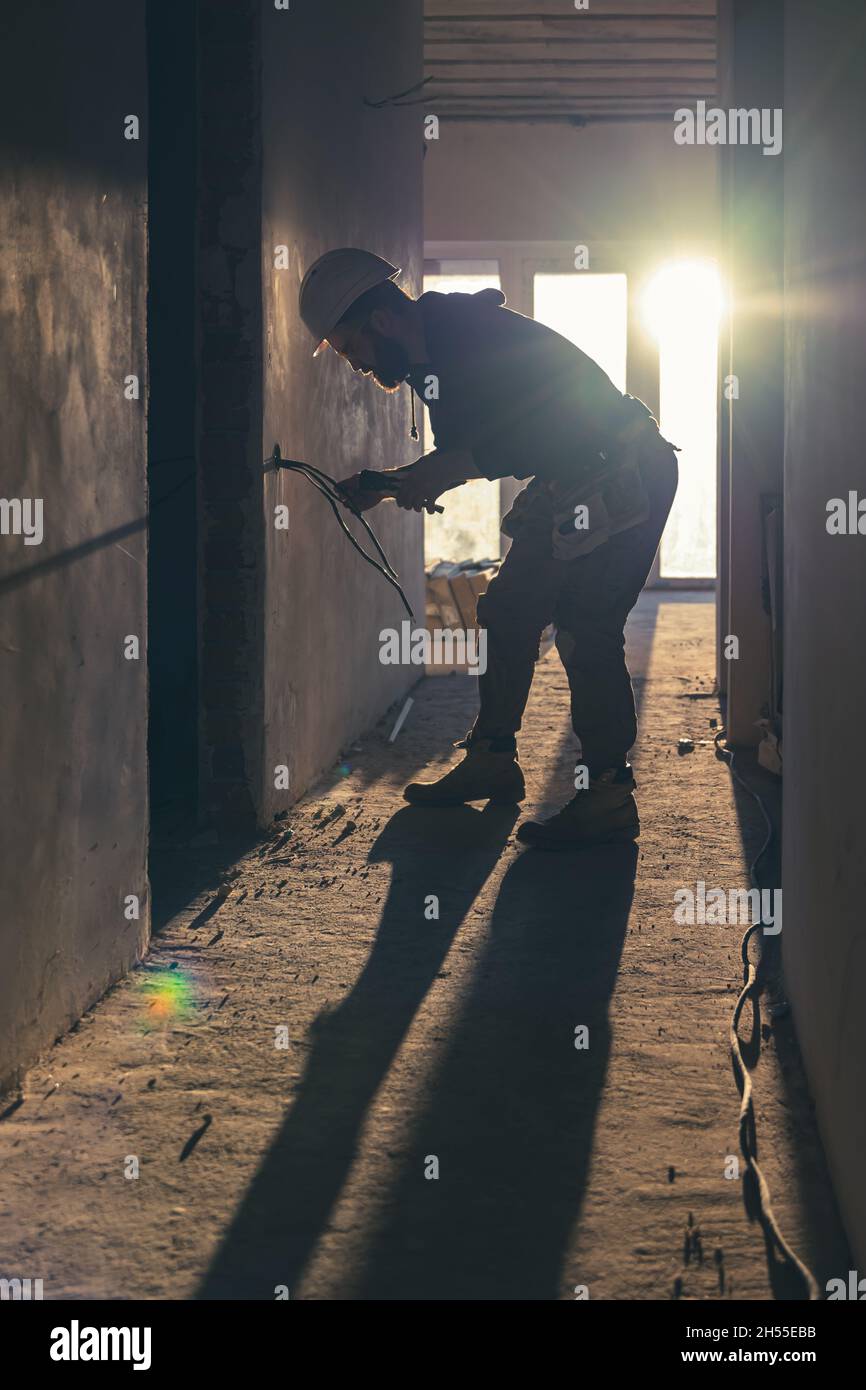 Worker is cutting wires with lineman's pliers Stock Photo - Alamy