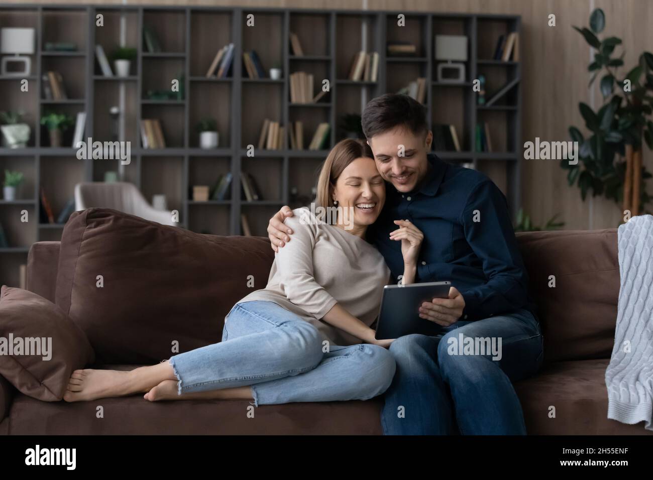 Happy family enjoying tablet hi-res stock photography and images - Alamy