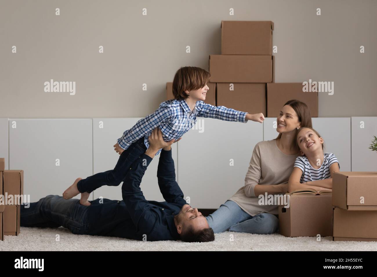 Child lifting box hi-res stock photography and images - Alamy