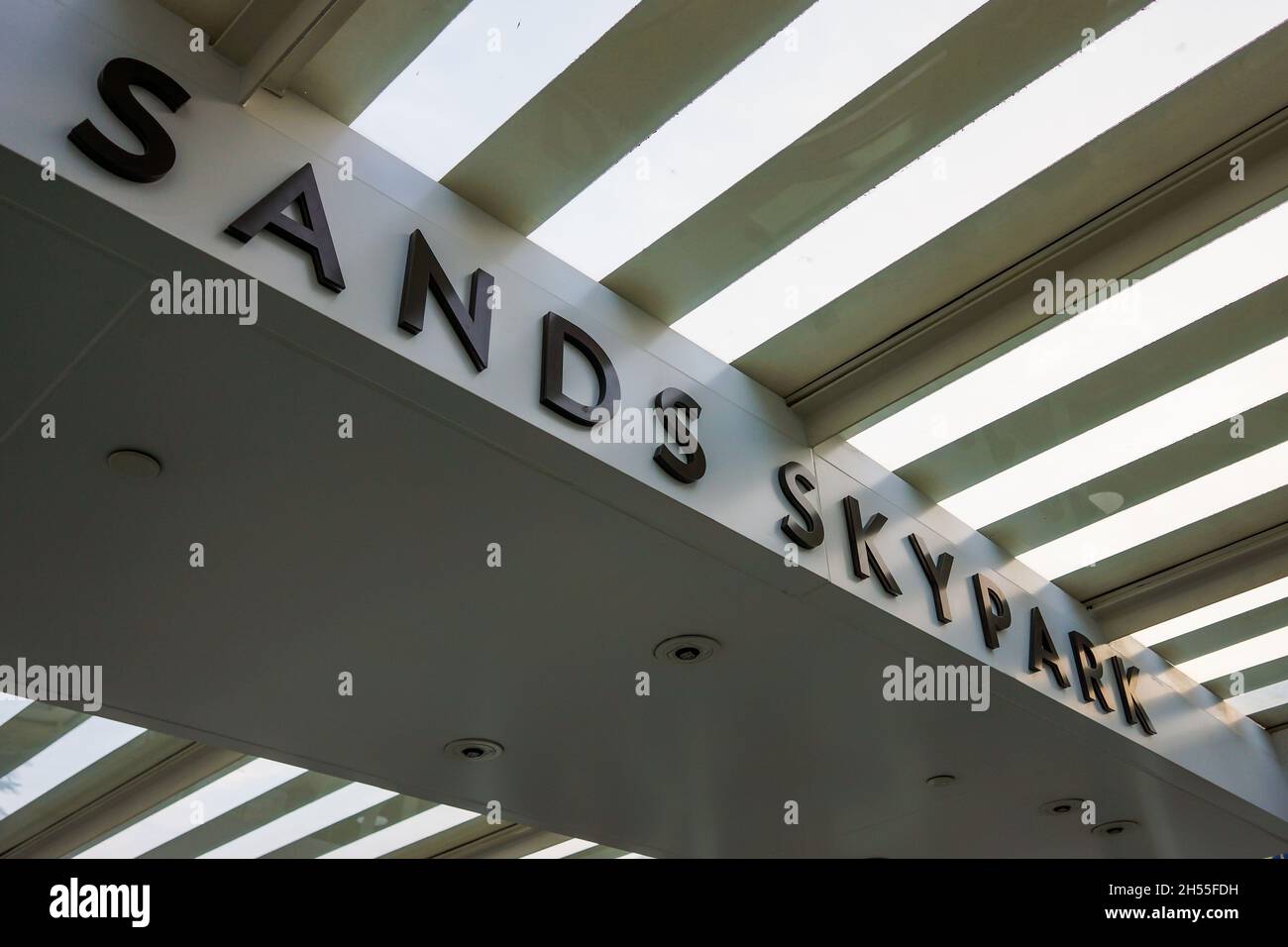 Close up of Sands Skypark text sign above the escalator to admittance ...