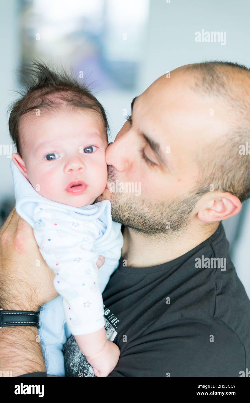 A close up of a father hugging the cute baby daughter with love Stock ...