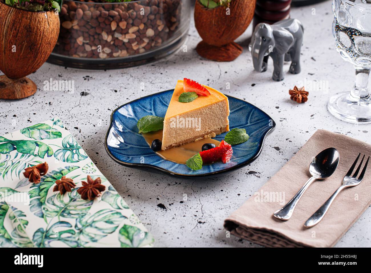 Slice of sweet cheesecake dessert Stock Photo - Alamy