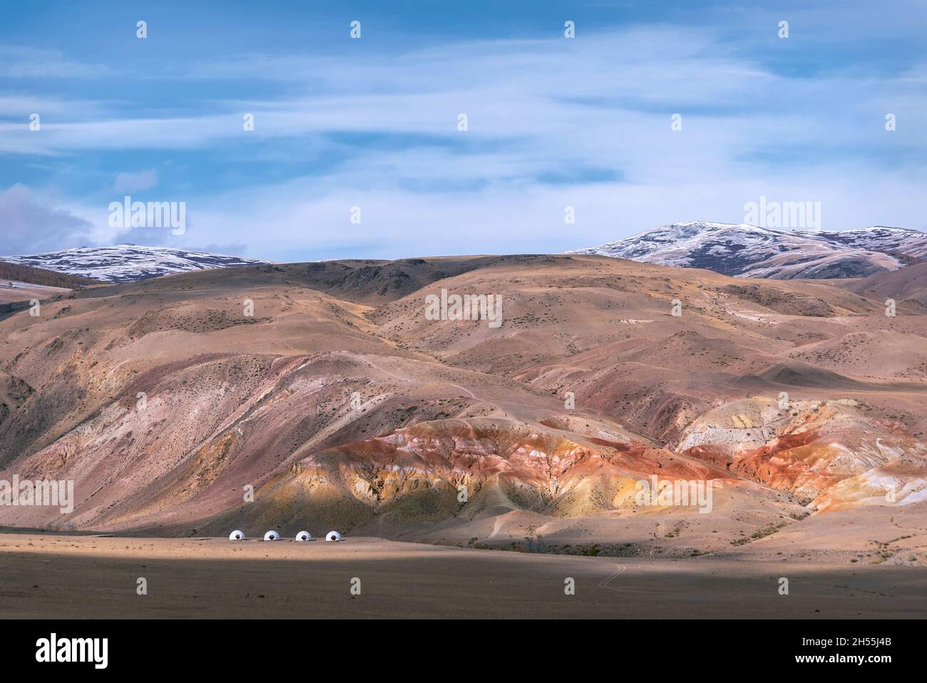 Colorful autumn landscape with colored and snowy mountains, steppe and ...