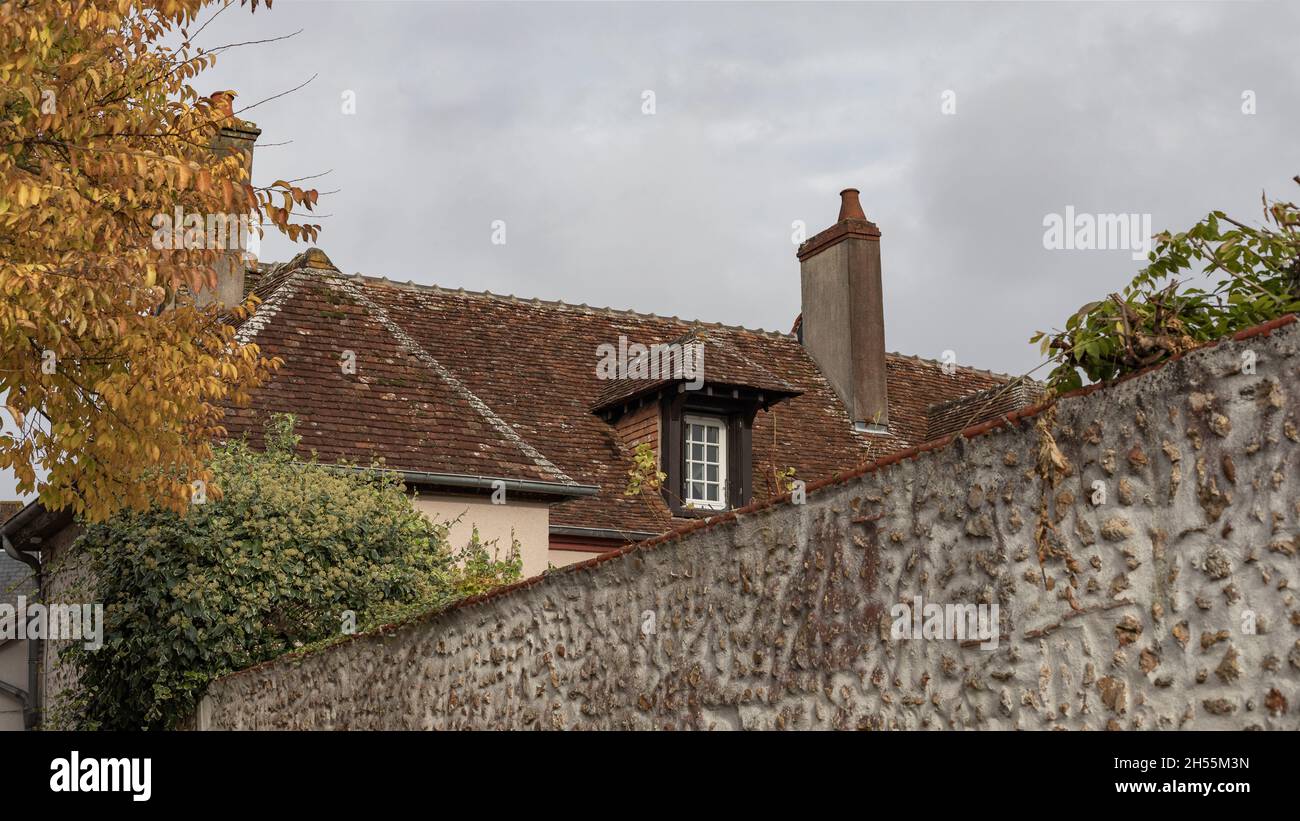 The roof top and attic window of an old french house Stock Photo - Alamy