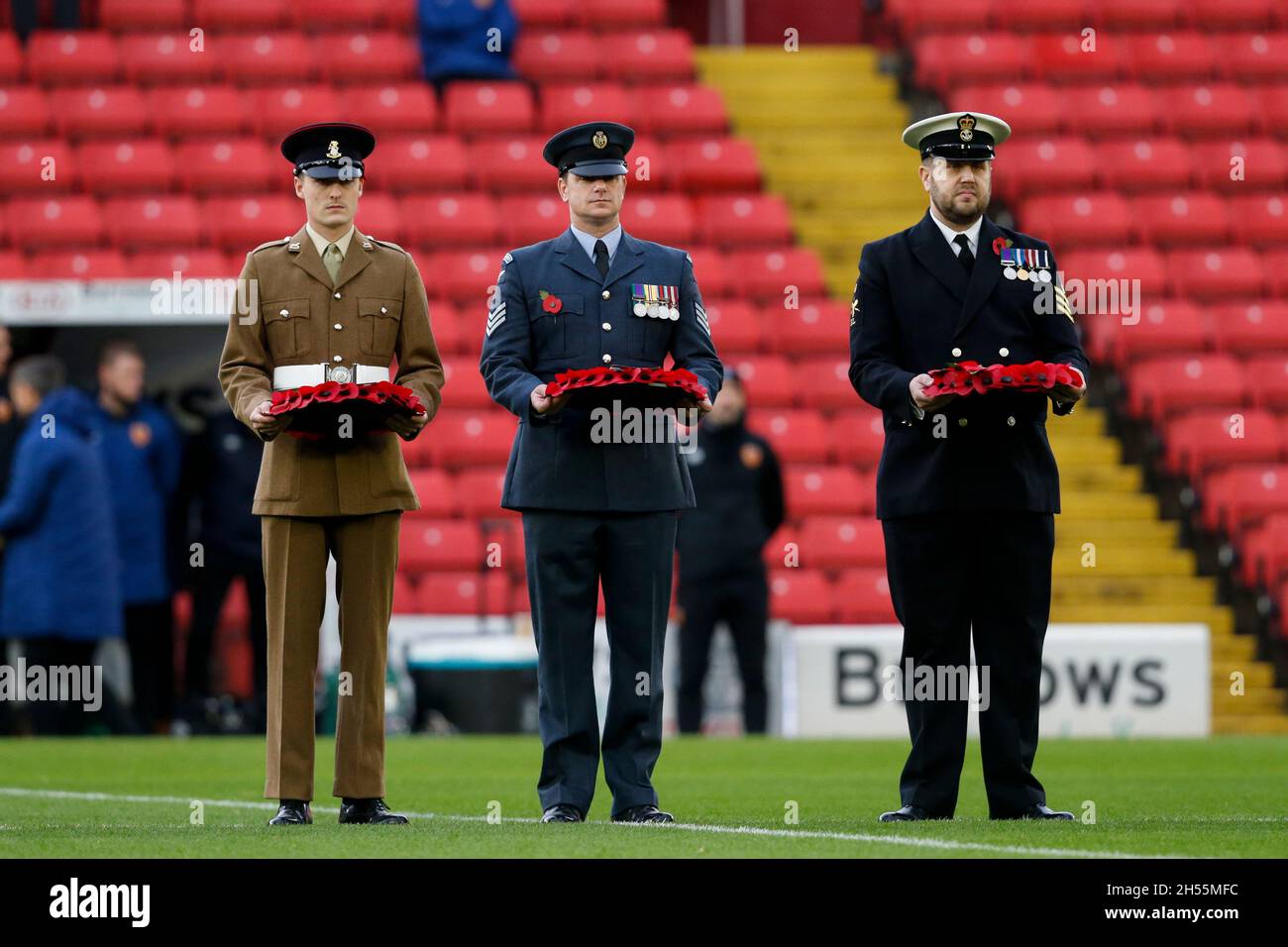Members of the armed forces lay wreaths as a mark of respect for ...