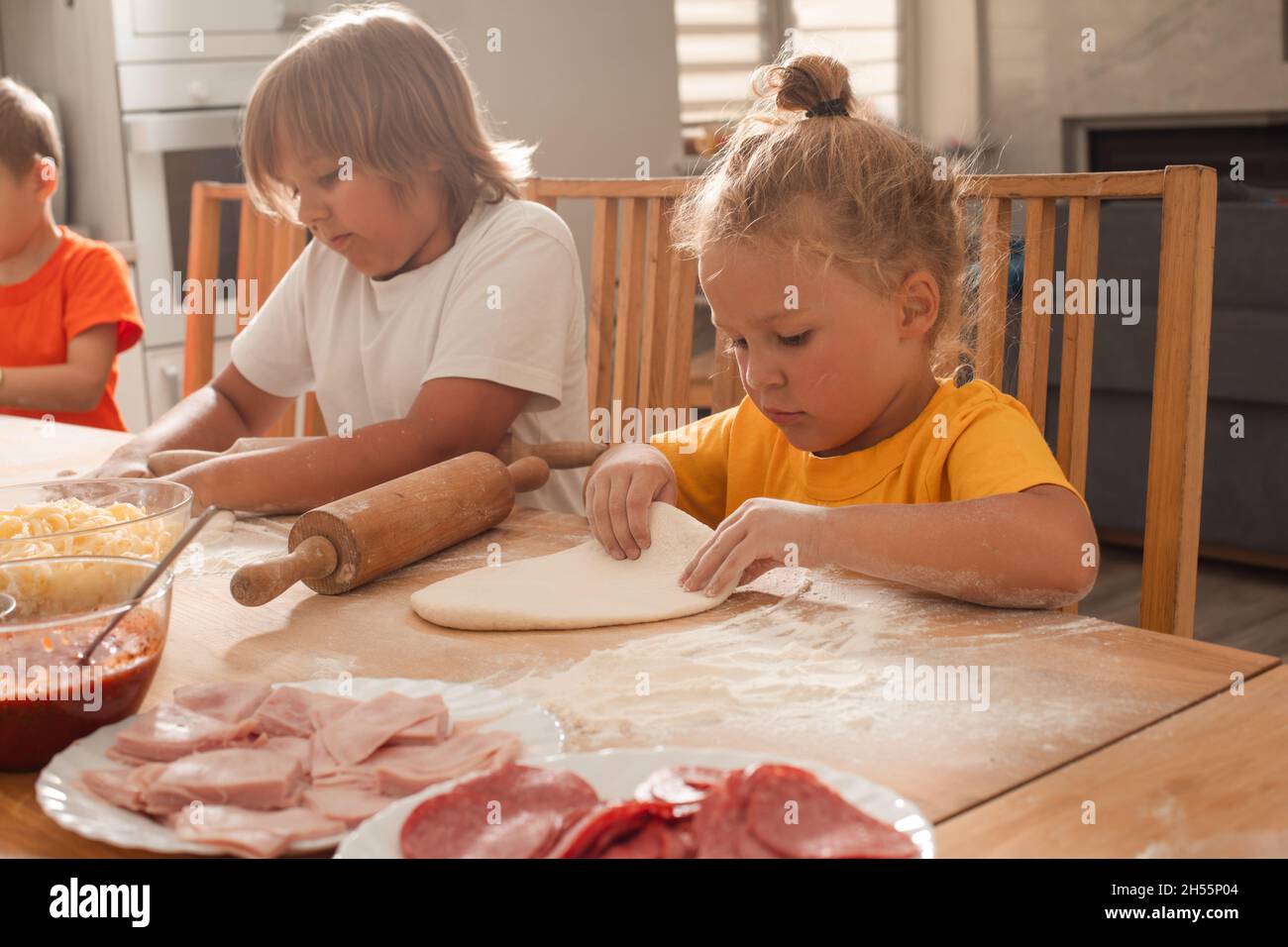 the little boy is preparing his favorite dish Stock Photo - Alamy