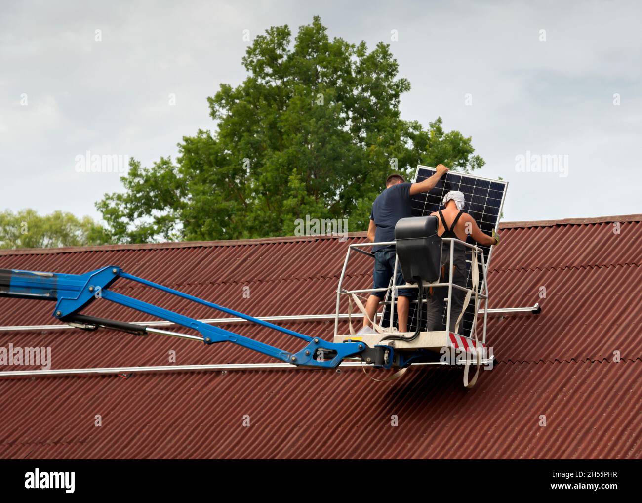 Montage of solar panel on a roof top Stock Photo - Alamy