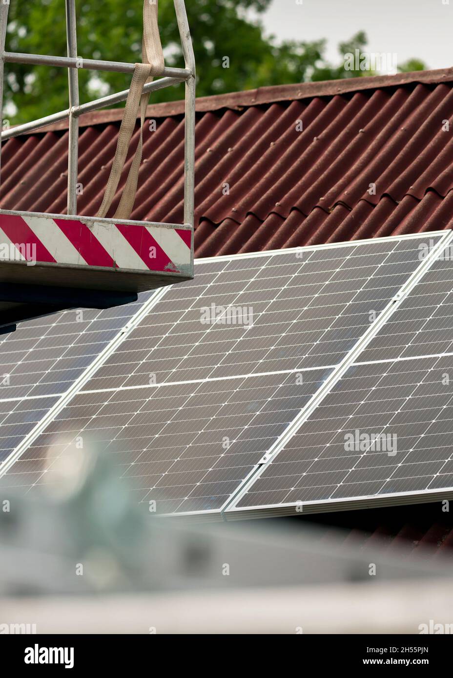 Montage of solar panel on a roof top Stock Photo - Alamy