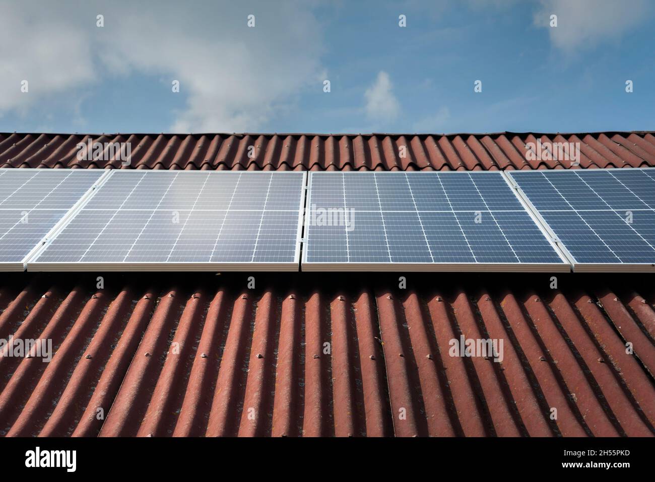 Montage of solar panel on a roof top Stock Photo - Alamy