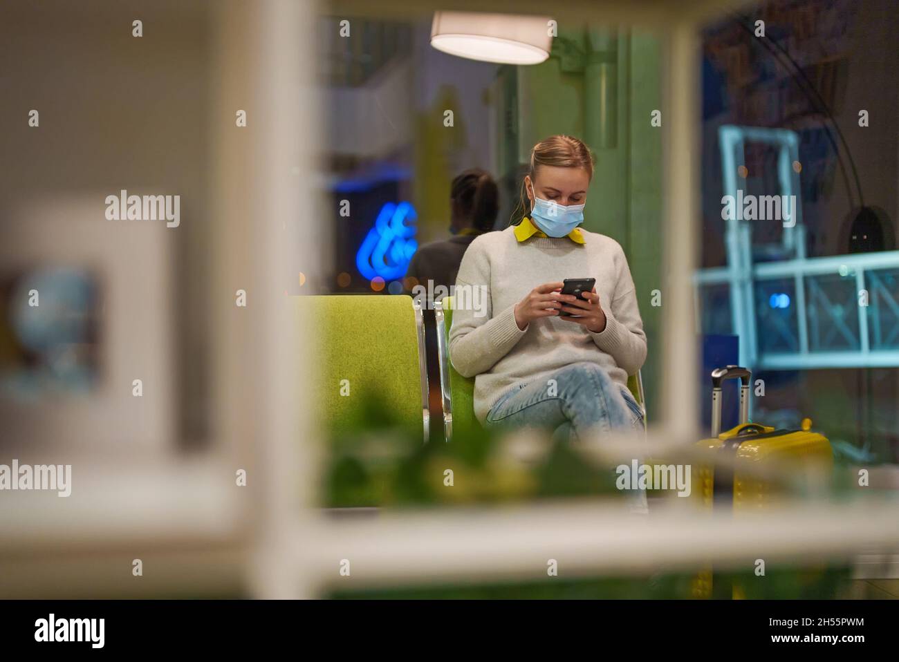 Woman in medical mask waiting for her check-in at the airport Stock ...