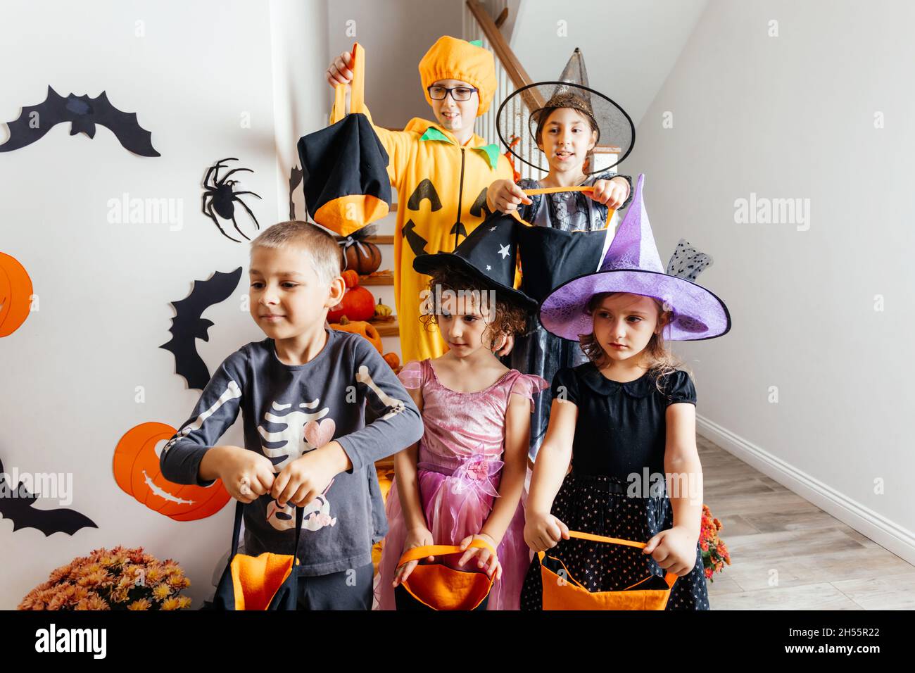Group of kids waiting for Halloween candies Stock Photo - Alamy