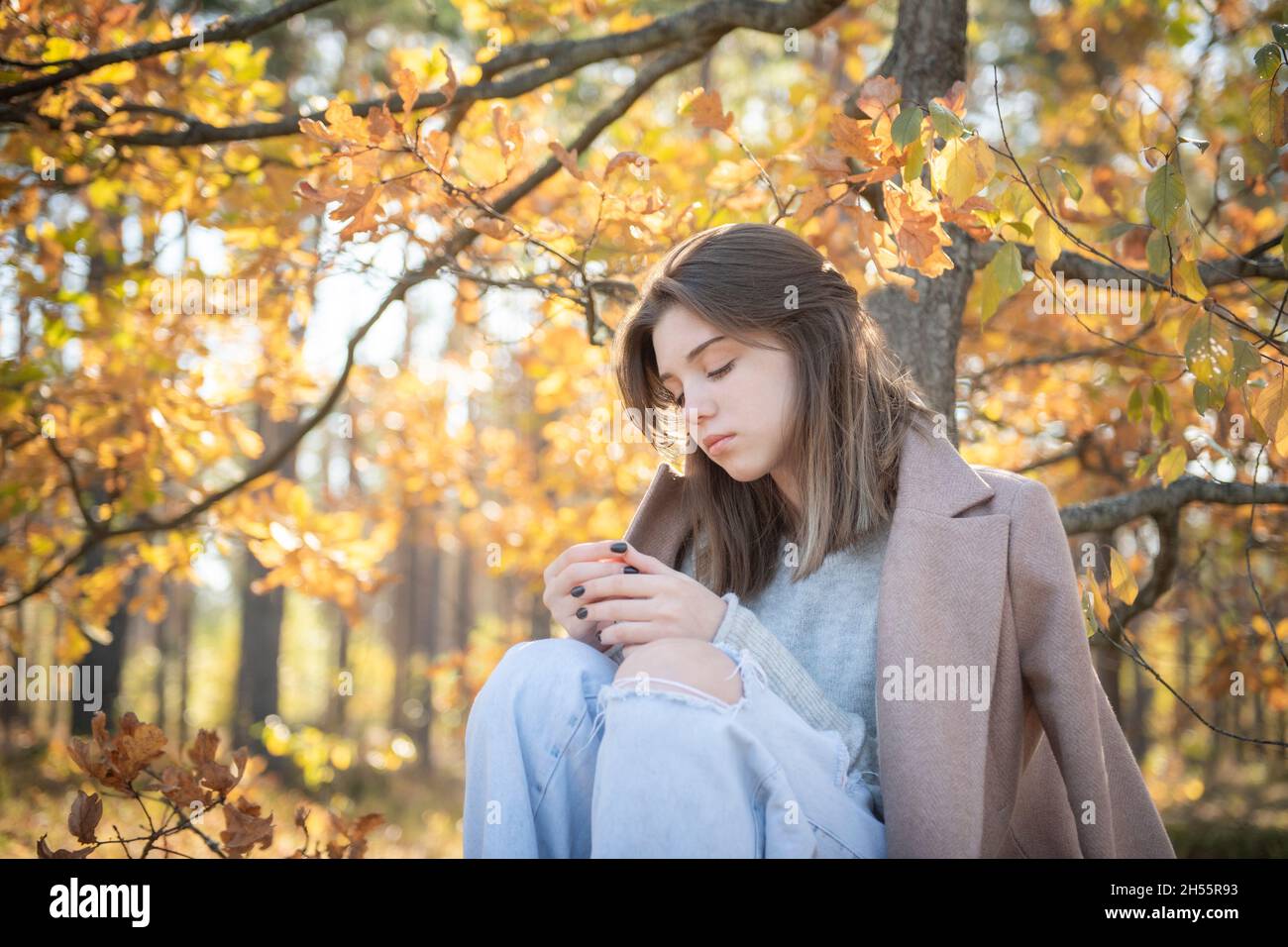 Portrait of a thoughtful and sad girl. Autumn colors . Lifestyle ...