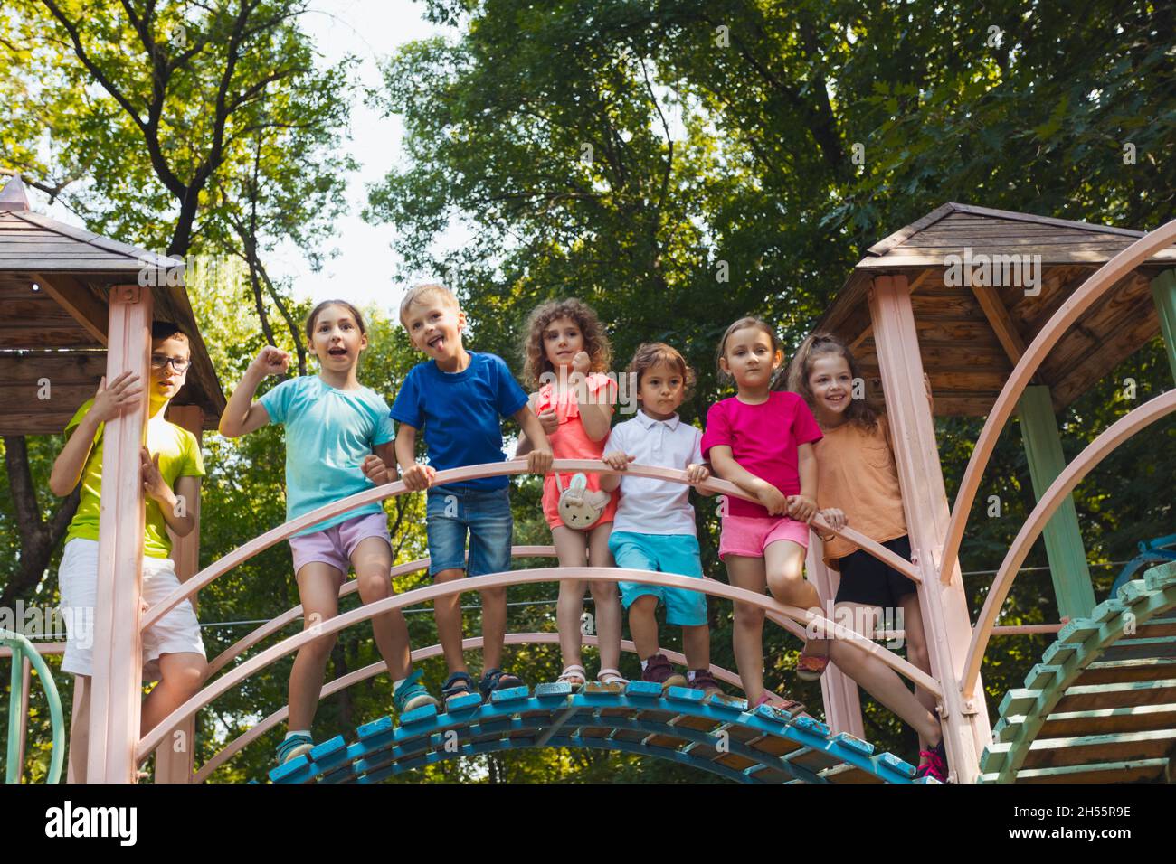 The group of friends spend time together in the playground Stock Photo ...