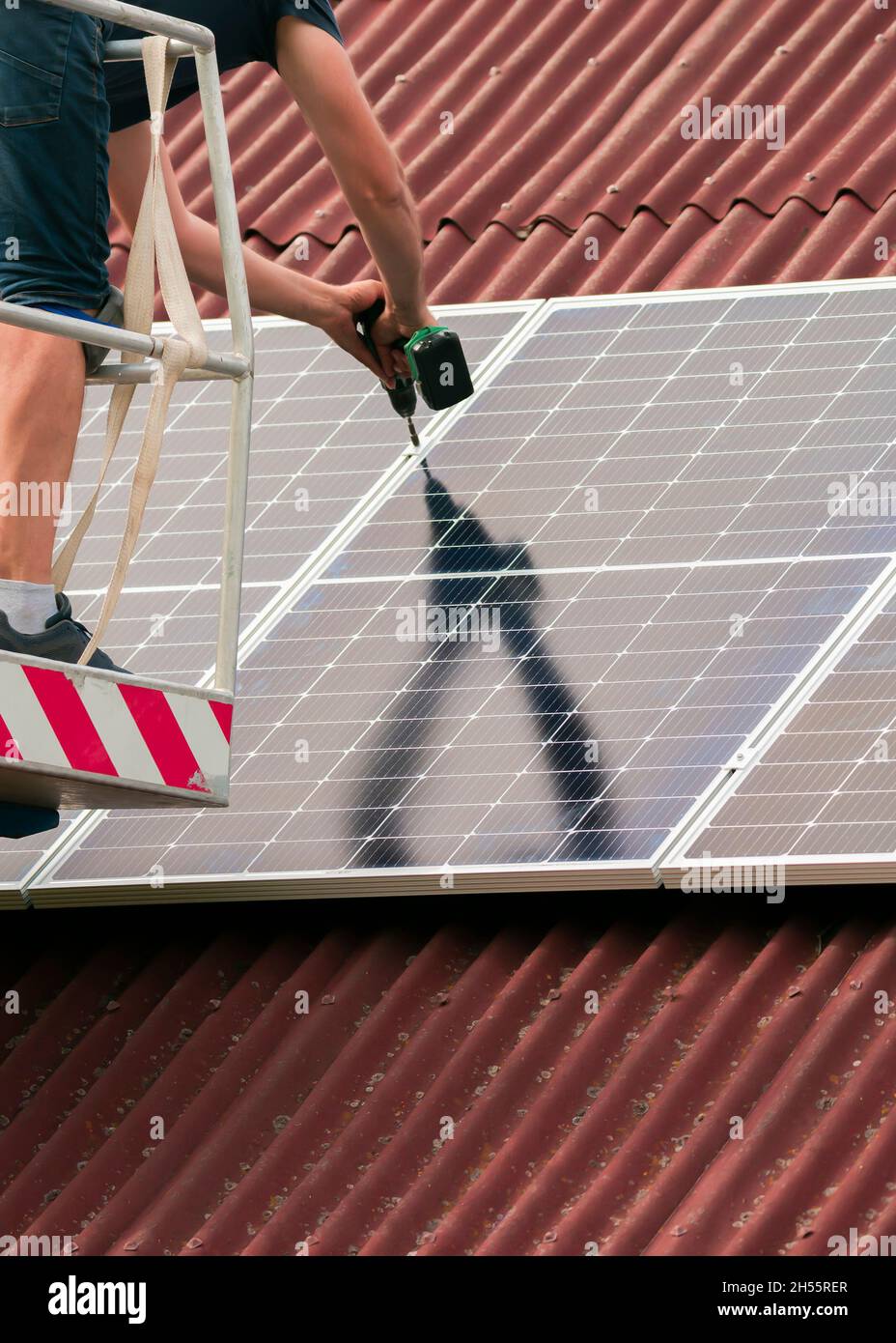 Montage of solar panel on a roof top Stock Photo - Alamy