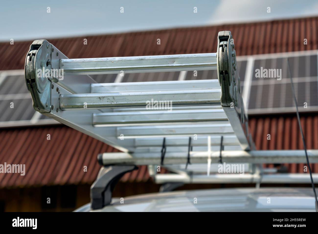 Montage of solar panel on a roof top Stock Photo - Alamy