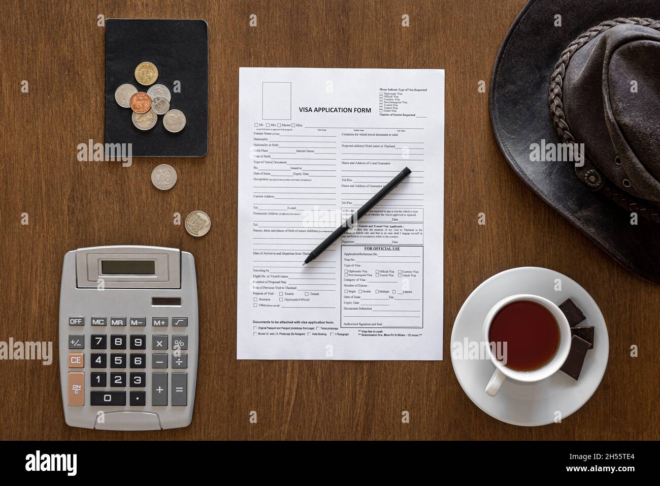 Visa application form on a wooden table, visa processing, registration ...