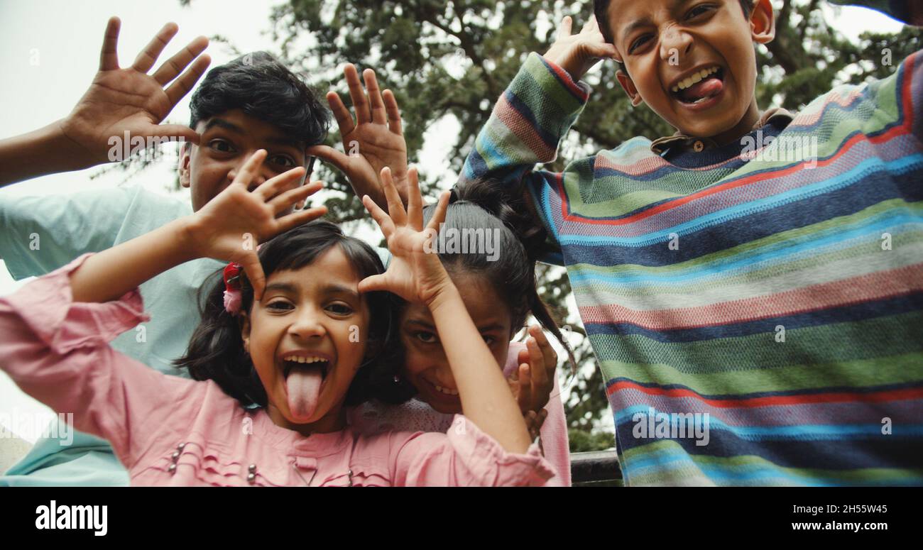 A Group of little south Asian kids playing and having fun together ...