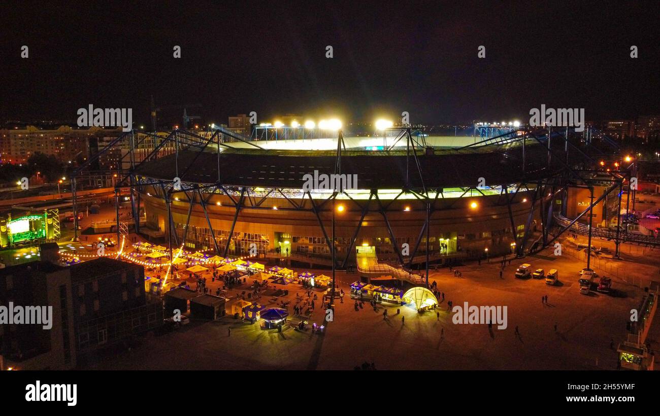 KHARKIV, UKRAINE - OCTOBER 24, 2021: Metalist stadium in night city ...