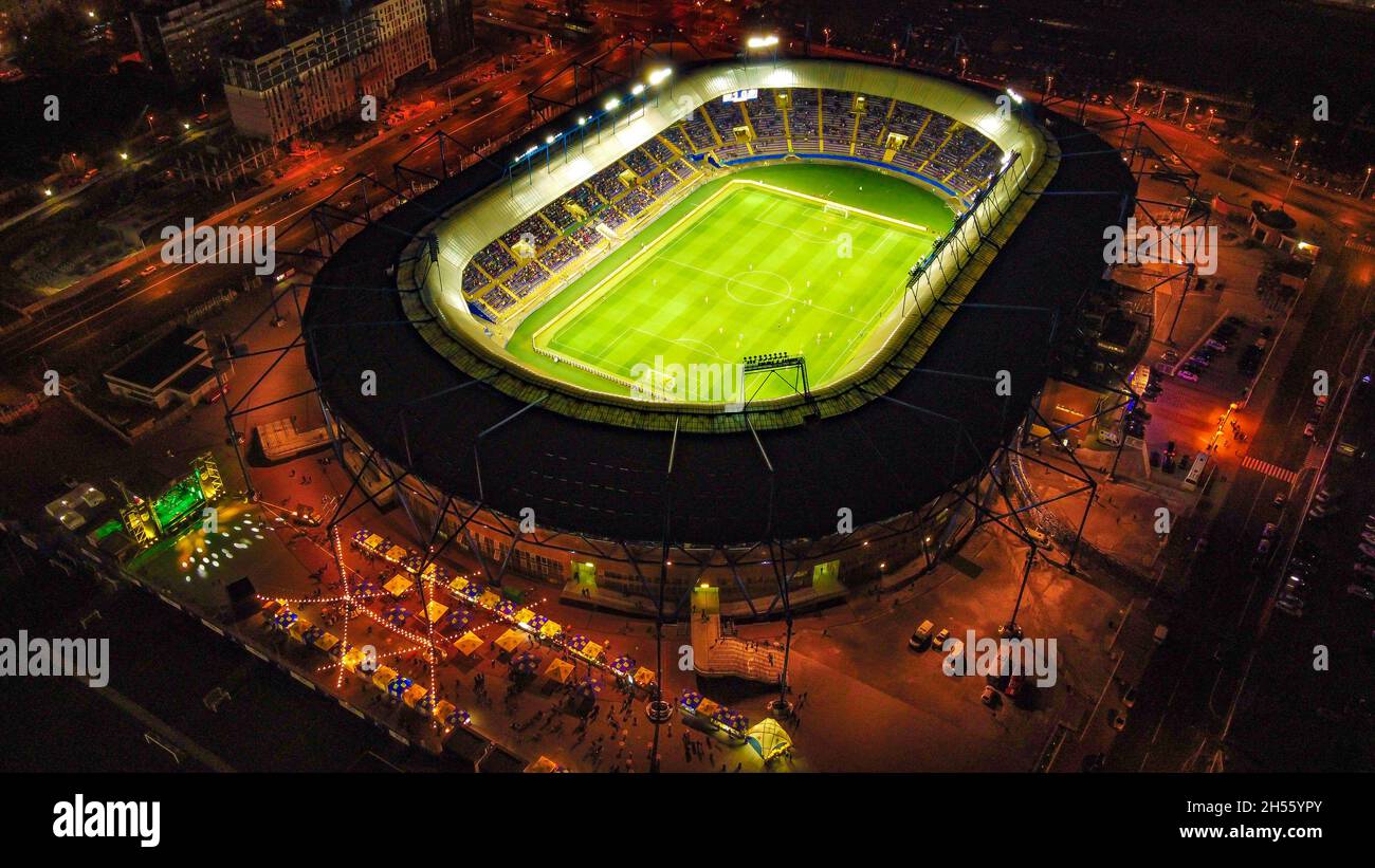 KHARKIV, UKRAINE - OCTOBER 24, 2021: Metalist stadium in night city ...