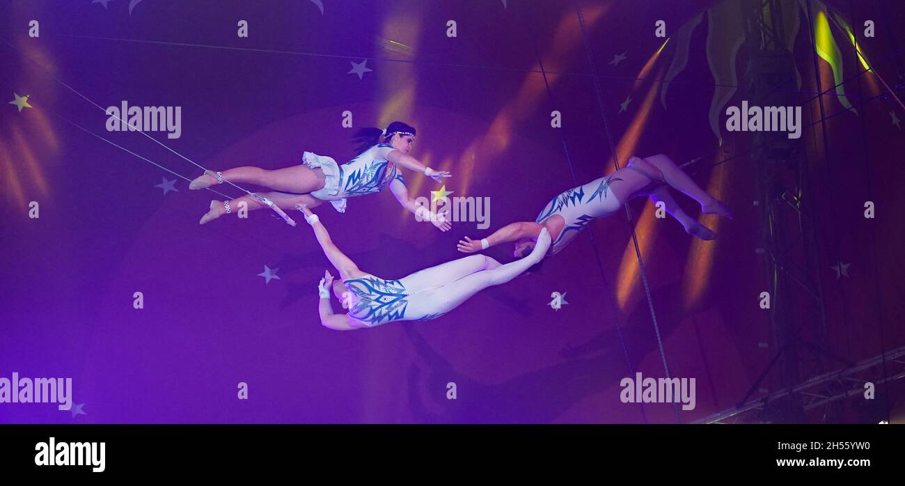 Trapeze act the "Flying Zuniga" perform in Tom Duffy's Circus which has ...