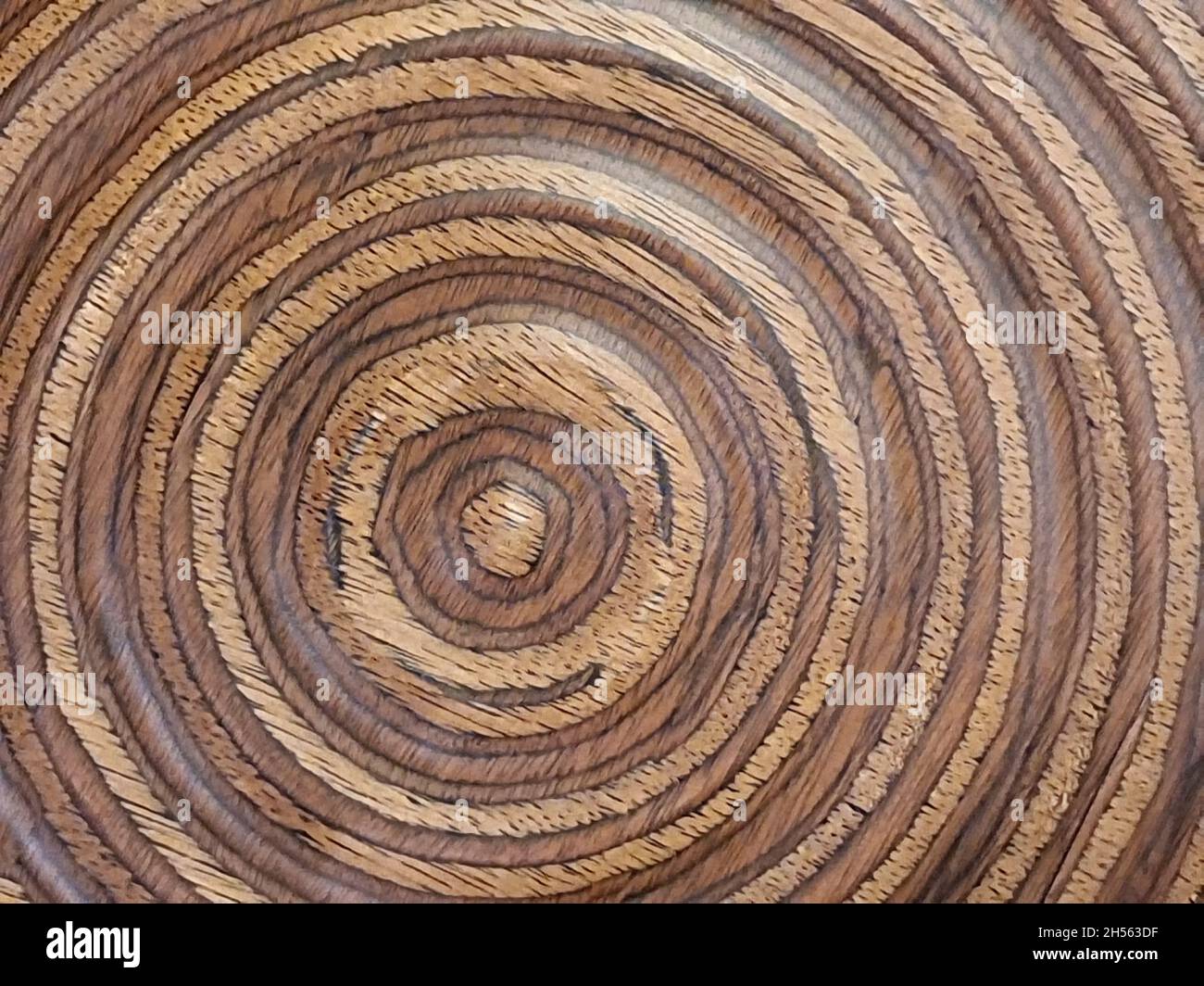 Beautiful and creative surface of a wooden table with circular designs ...