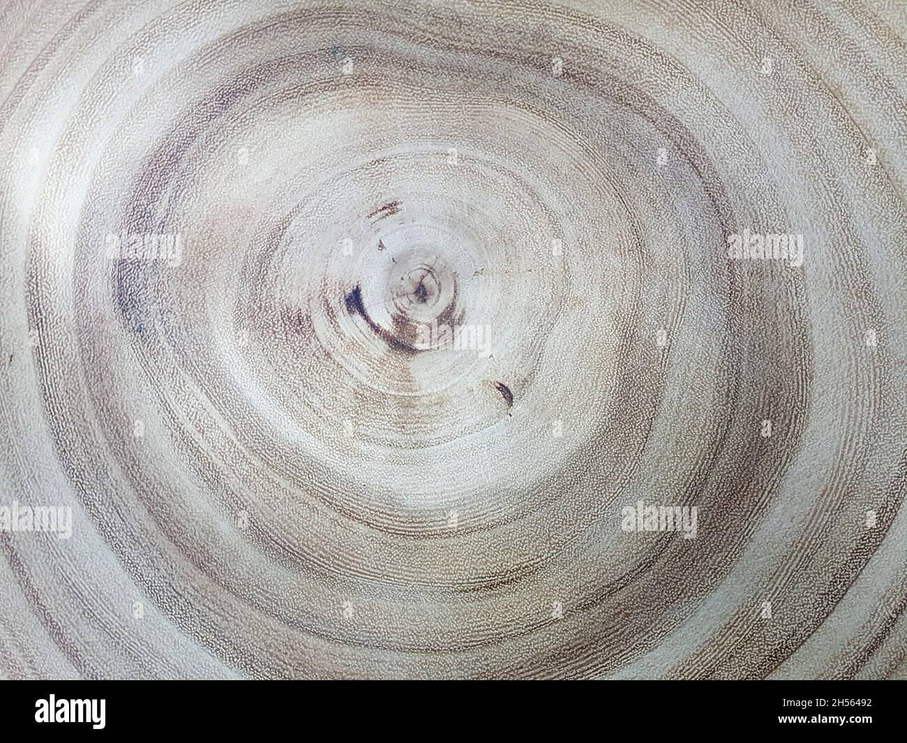 Beautiful and creative surface of a wooden table with circular designs ...