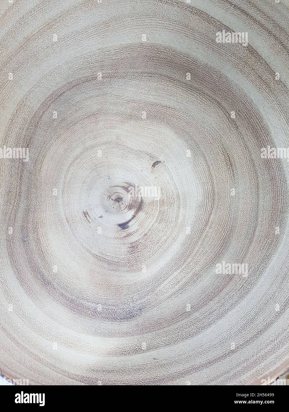 Beautiful and creative surface of a wooden table with circular designs ...