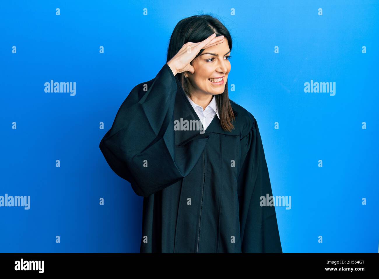 Young hispanic woman wearing judge uniform very happy and smiling ...