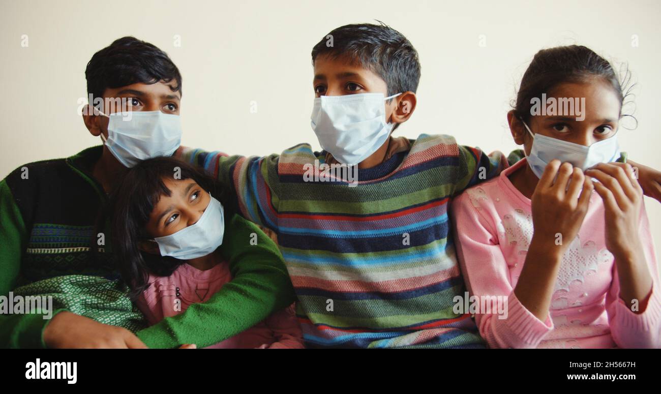 Cute children with masks playing at home Stock Photo - Alamy