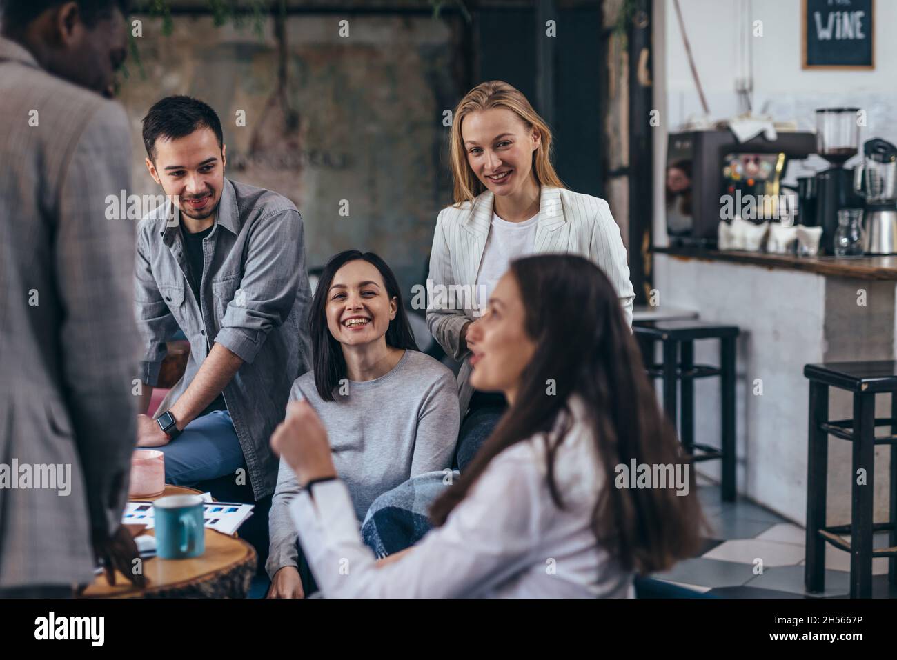 People in office talking during informal meeting Stock Photo - Alamy