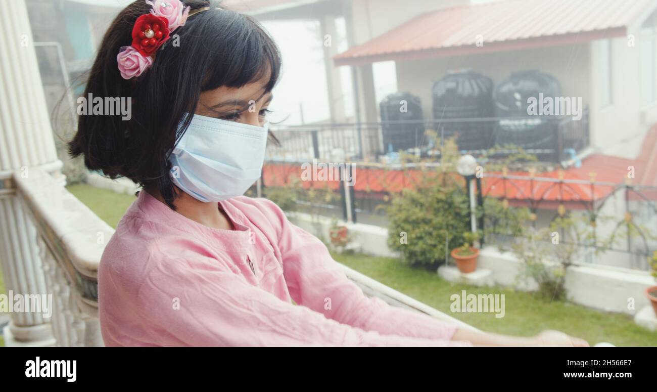 Cute children with masks playing at home Stock Photo - Alamy