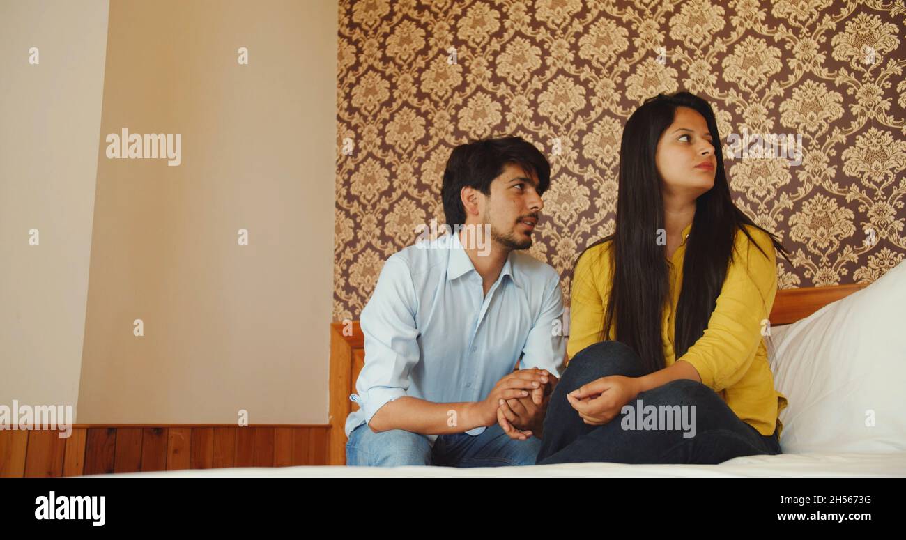 An Indian couple sitting and speaking at home Stock Photo - Alamy