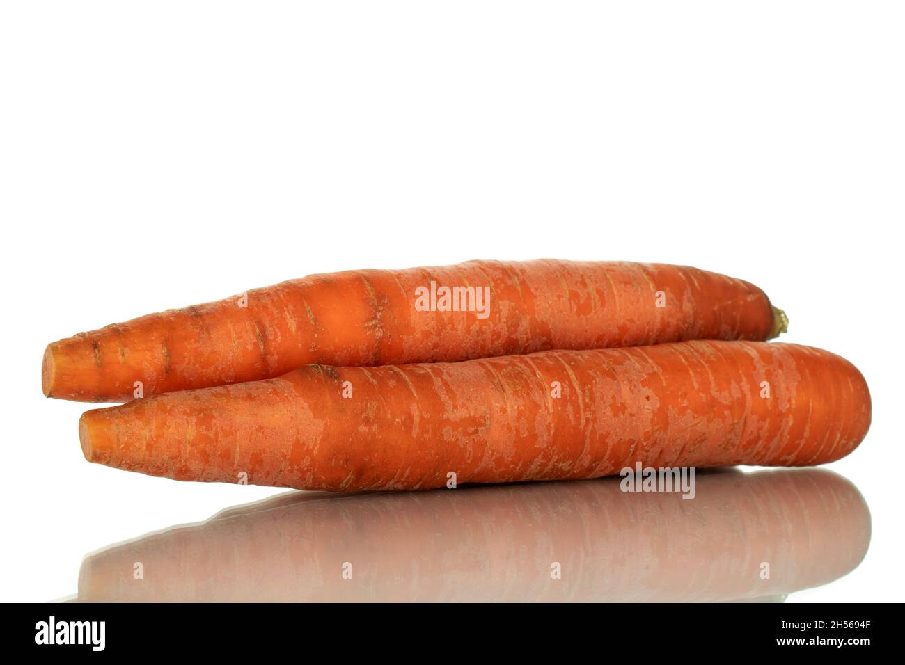 Two unpeeled organic carrots, close-up, isolated on white Stock Photo ...