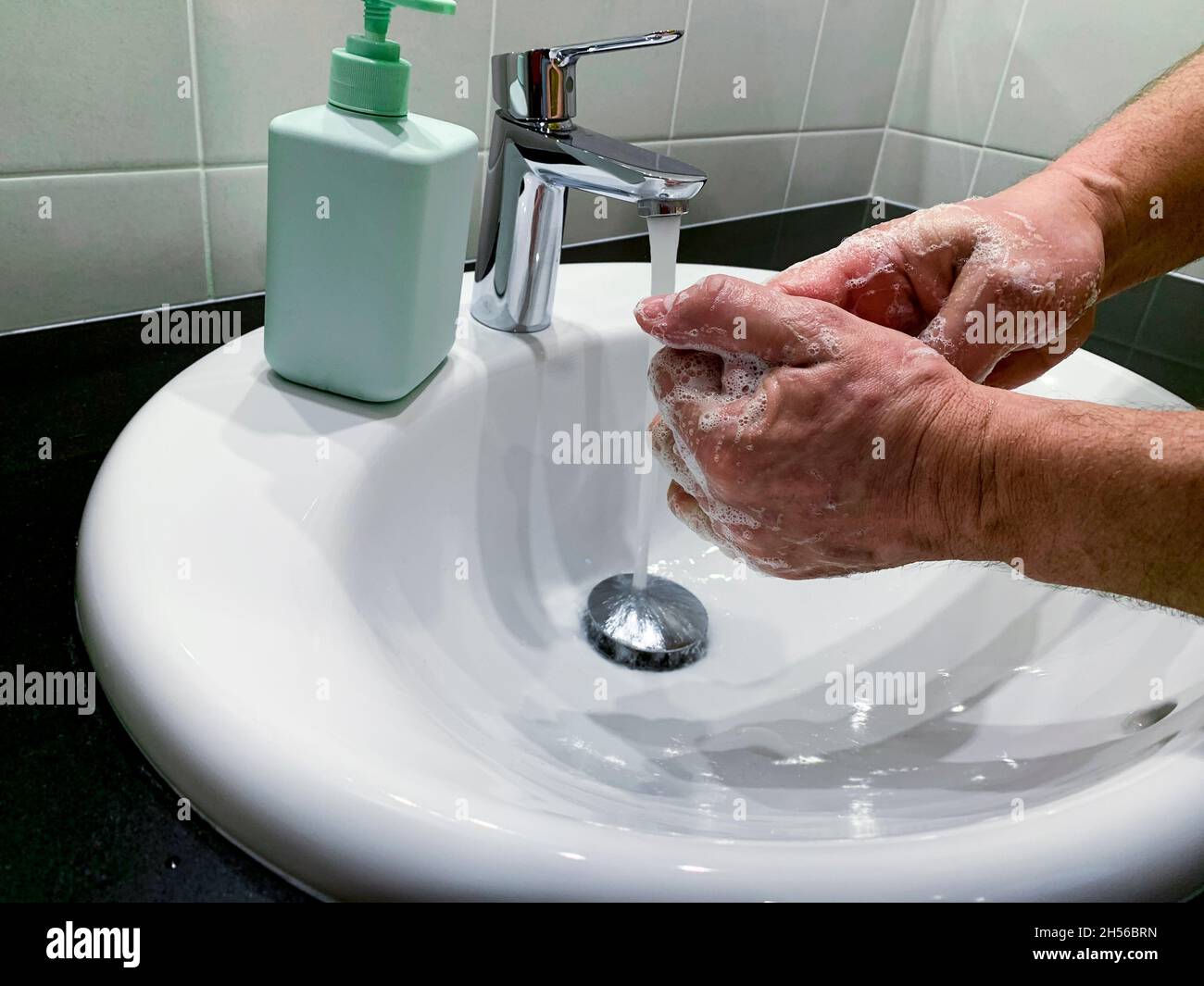 Washing hands with soap man for coronavirus prevention. Stoping ...