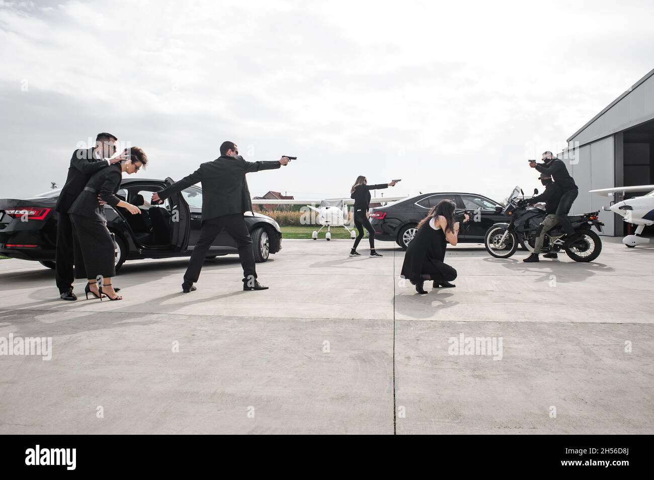 Tactical exercise training. An armed bodyguard security team protects a ...
