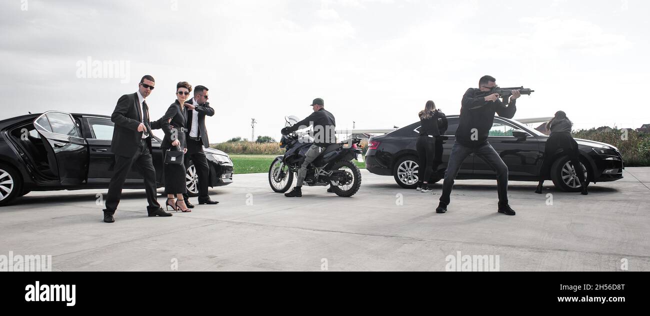 Tactical exercise training. An armed bodyguard security team protects a ...