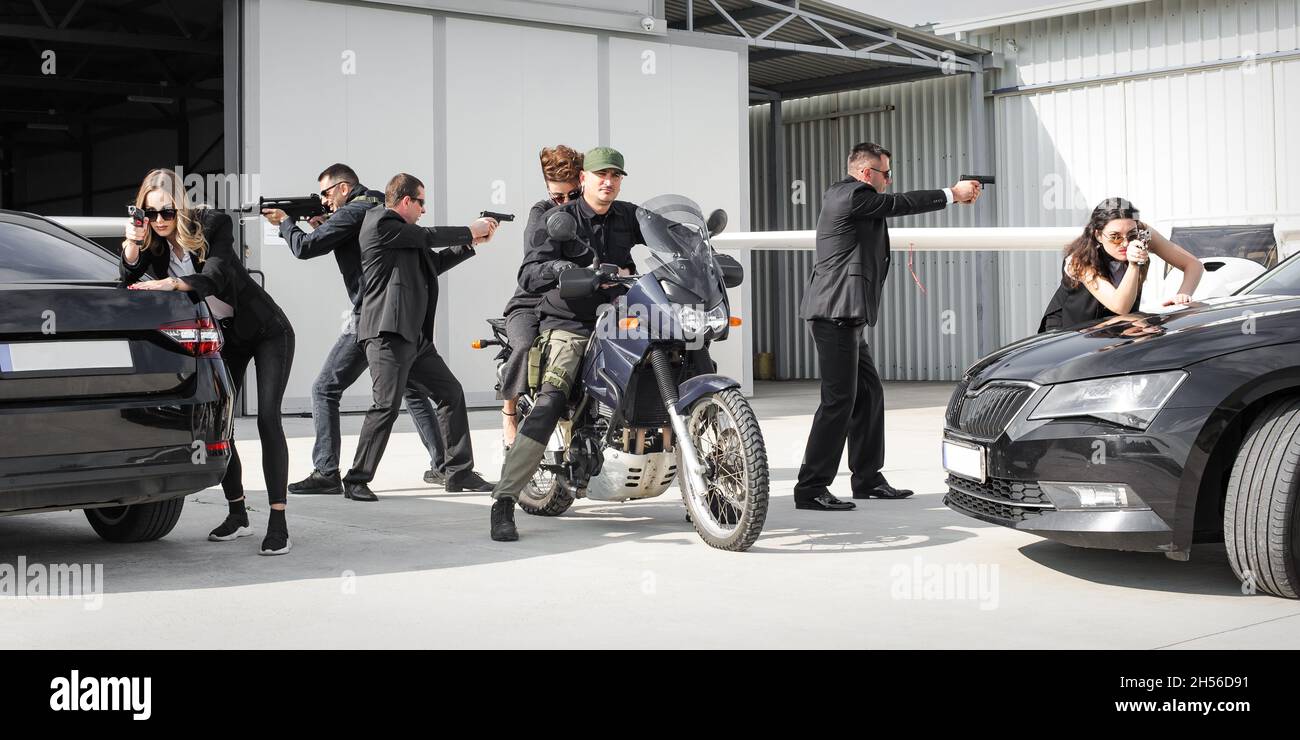 Tactical exercise training. An armed bodyguard security team protects a ...
