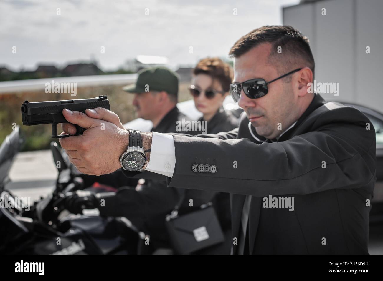 Tactical exercise training. An armed bodyguard security team protects a ...