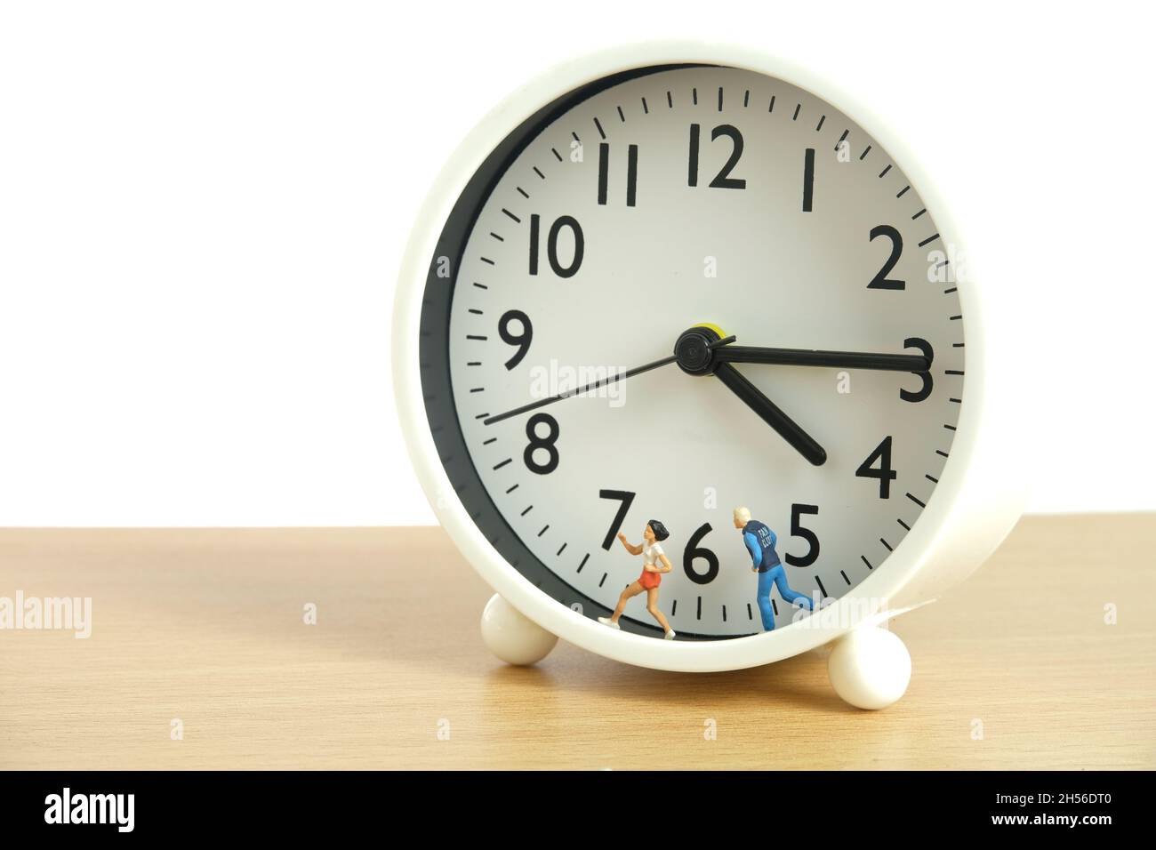 Miniature people toy figure photography. Running daily routine concept ...