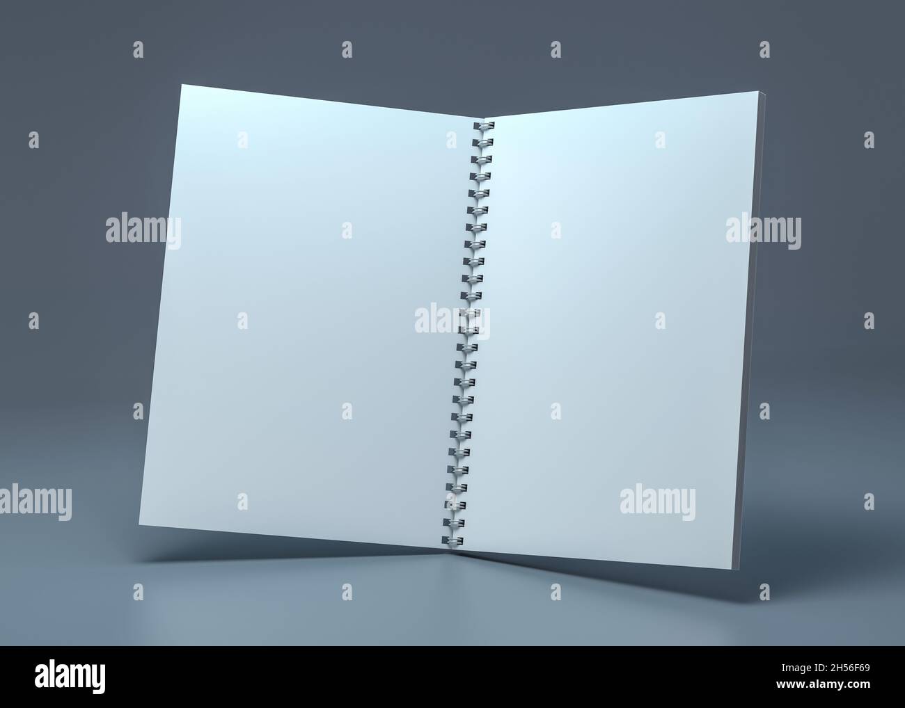 Blank spiral notebook on a light blue background. Template for your ...