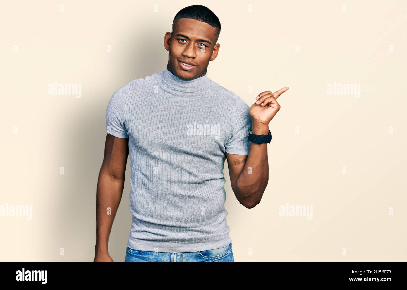 Young black man wearing casual t shirt with a big smile on face ...