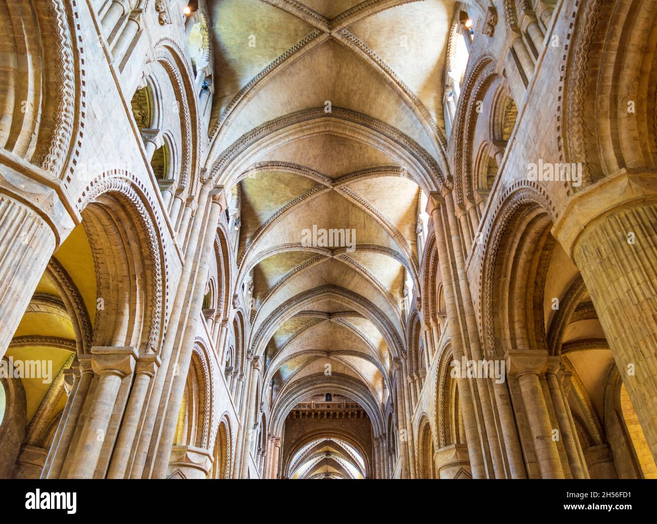 Sun shines through the stained glass windows of Durham cathedral Stock ...