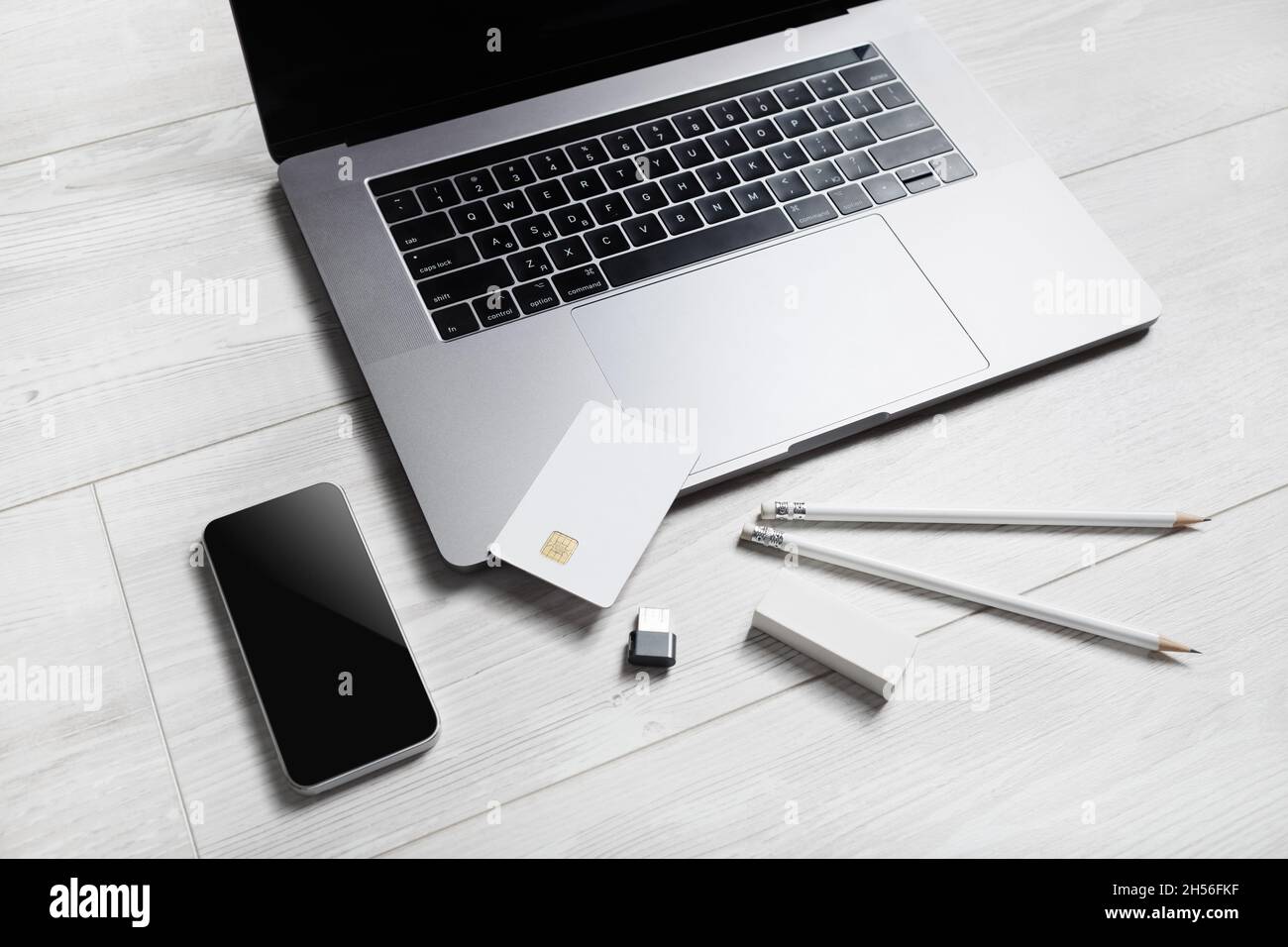 Gadgets and supplies. Laptop, smartphone, credit card, pencils, eraser ...