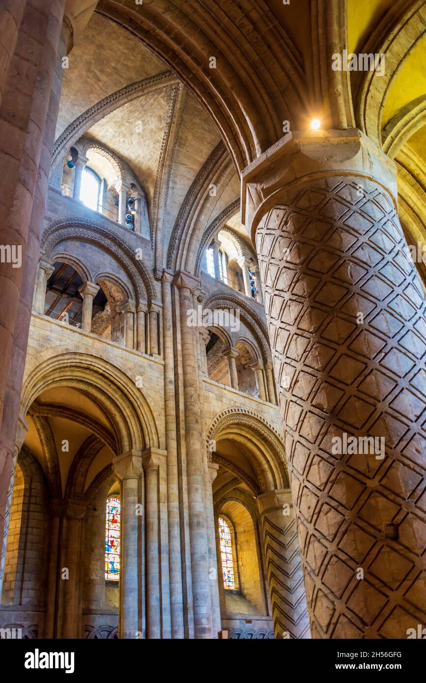 Sun shines through the stained glass windows of Durham cathedral Stock ...