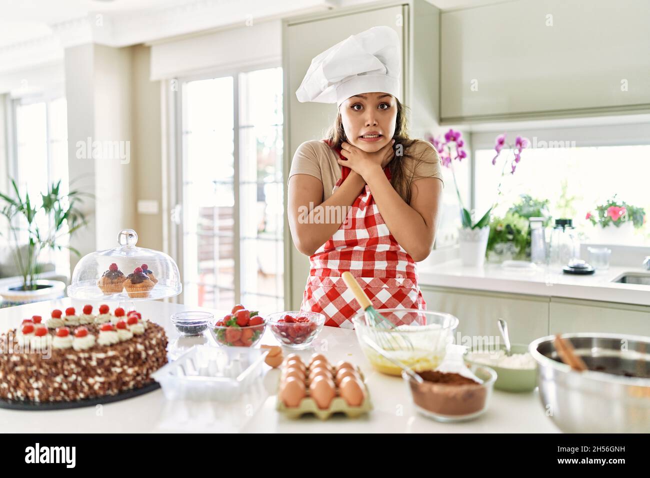 Woman choking kitchen hi-res stock photography and images - Alamy