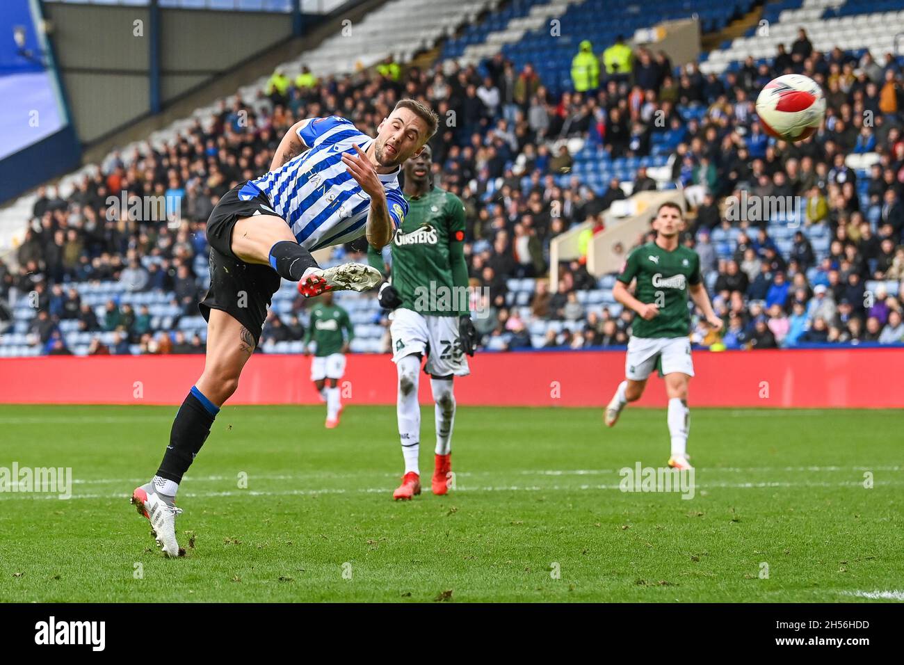 Lewis Wing #26 of Sheffield Wednesday shoots on goal but goes over the ...