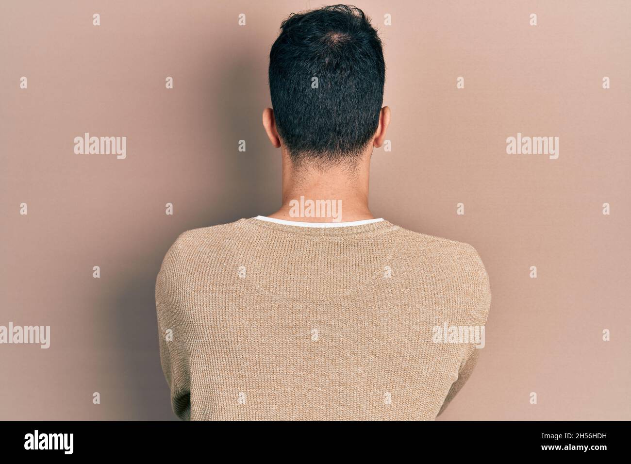 Young hispanic man wearing casual clothes and glasses standing ...