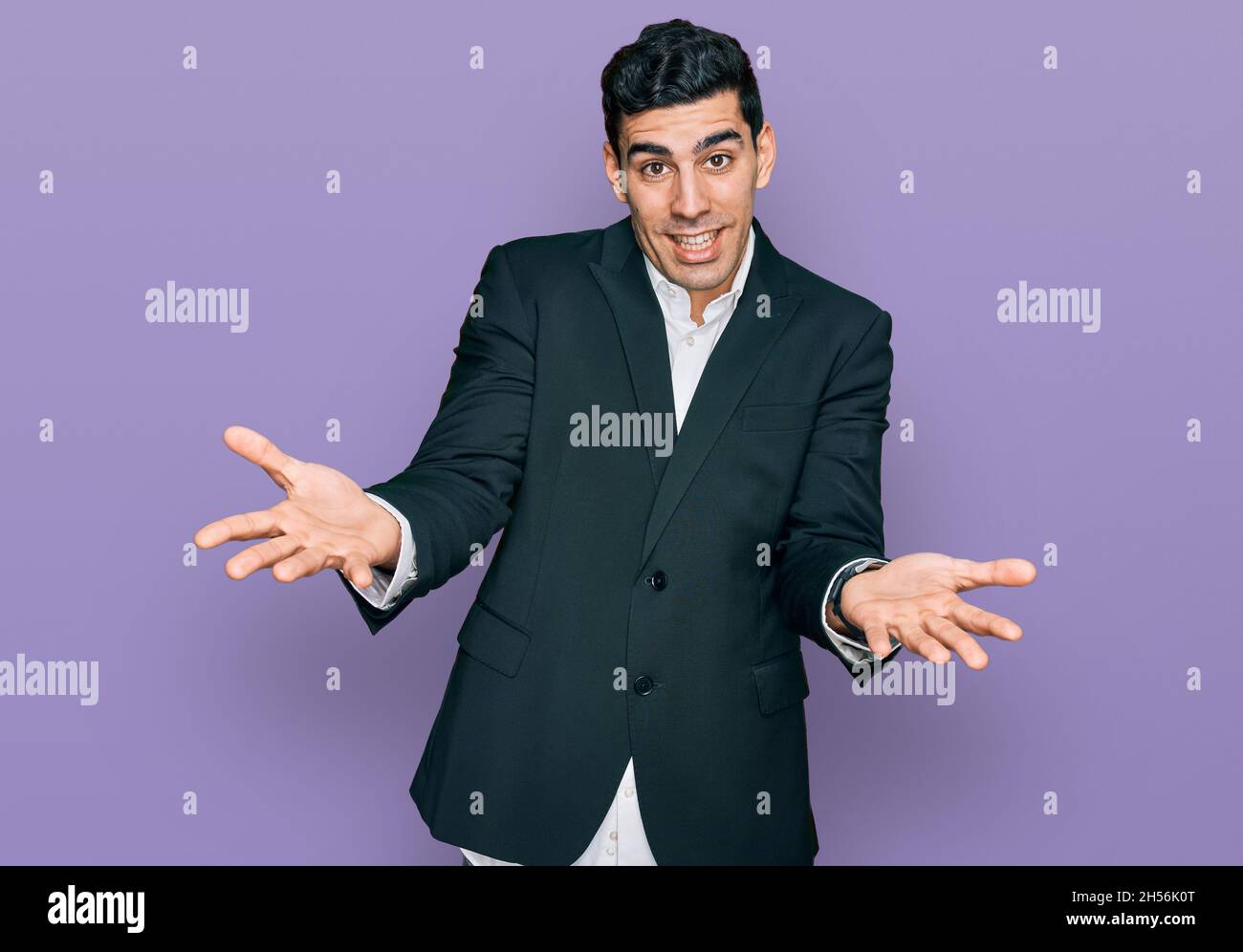 Handsome hispanic man wearing business clothes smiling cheerful ...